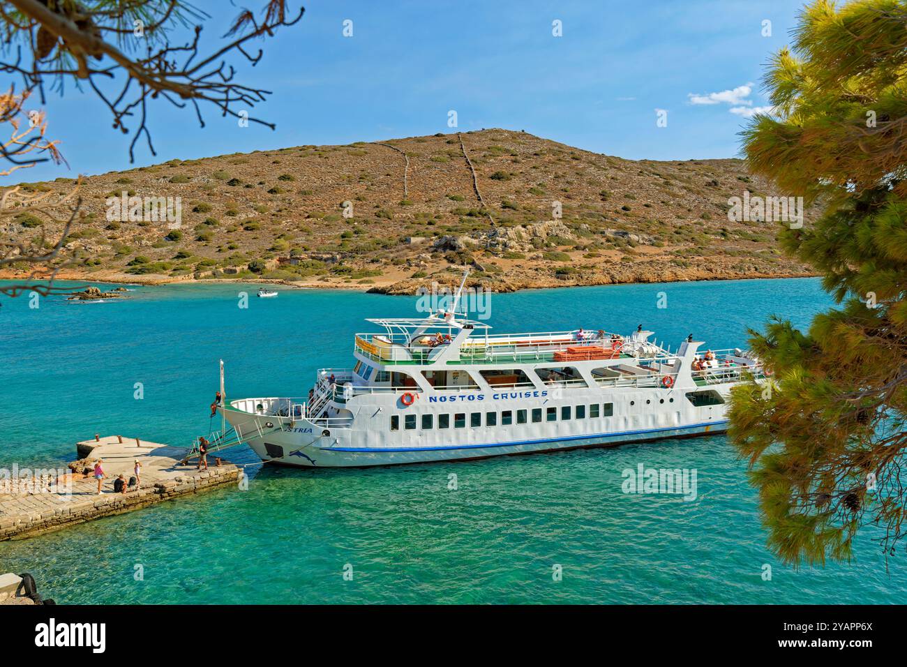 Tour boat at Spinalonga island, a former leper colony island located ...
