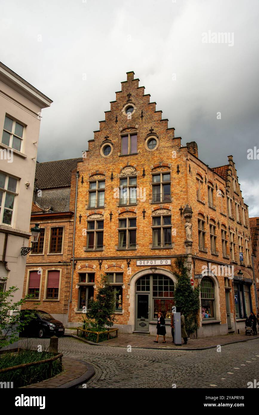 Traditional crow-stepped gable, oculus windows and corner sculpture in ...