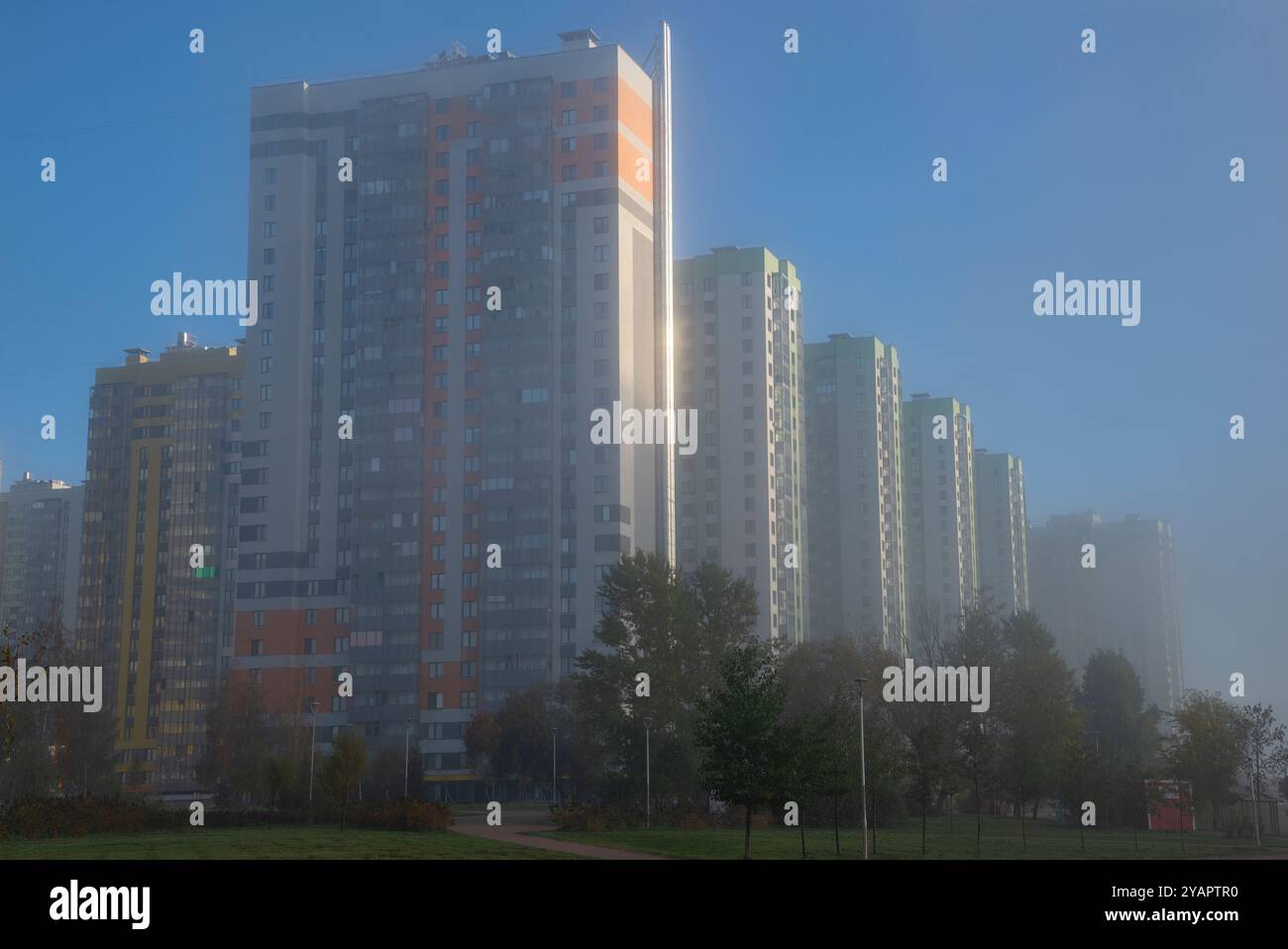 Modern high-rise buildings in the morning autumn fog. Saint Petersburg ...