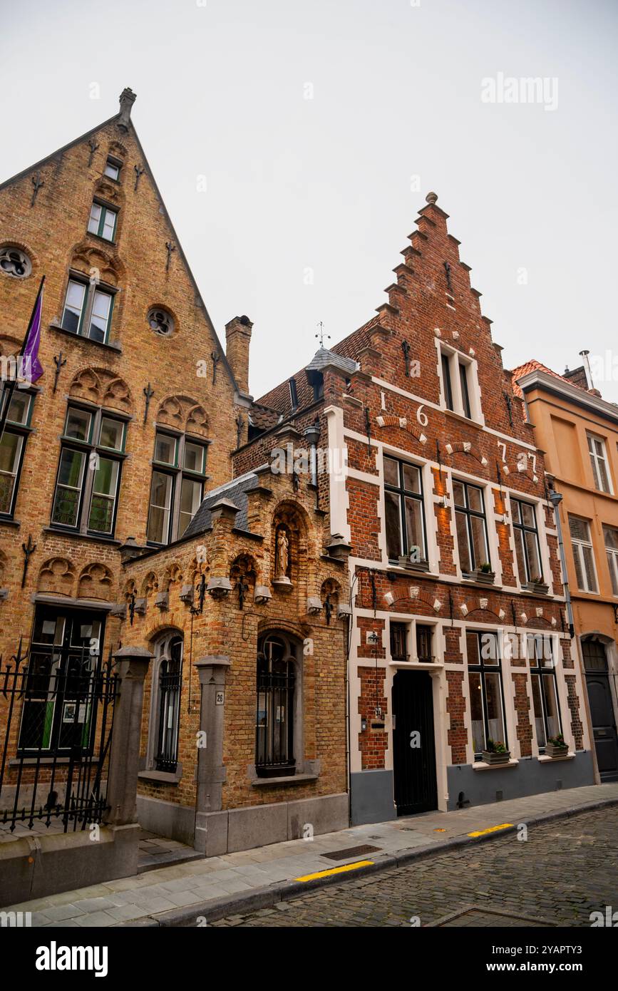 Brick Gothic tracery window pediments in medieval Bruges, Belgium Stock ...