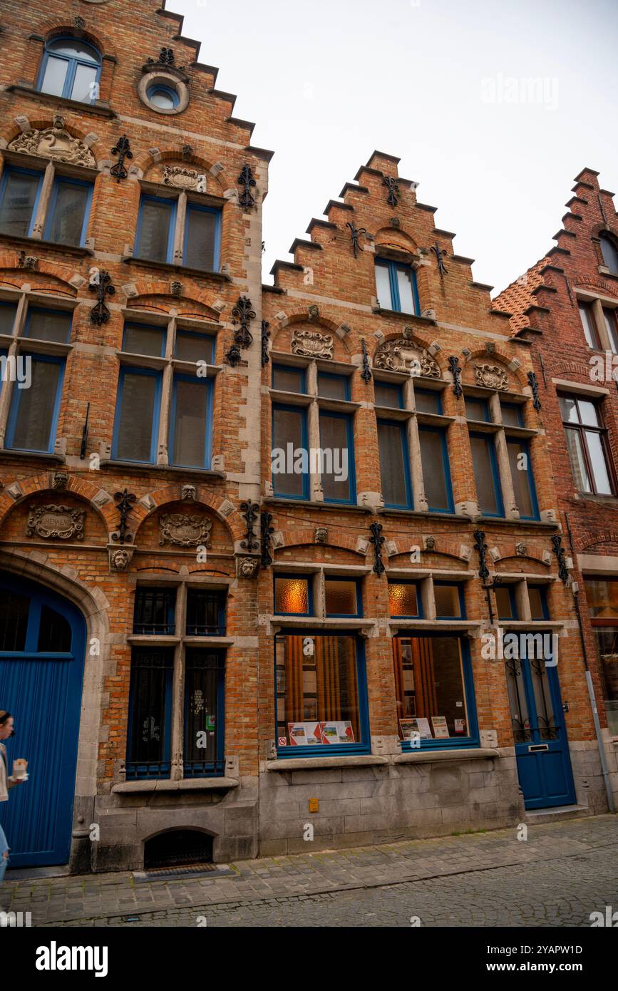 Stepped gable and cartouche window pediments in medieval Bruges ...