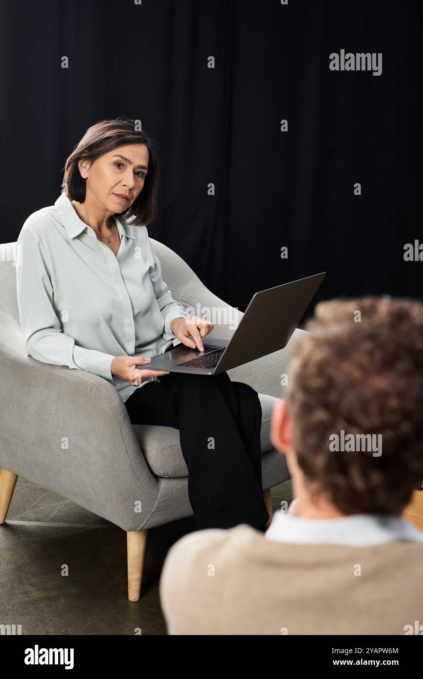 A middle-aged journalist engages in an insightful interview with a ...