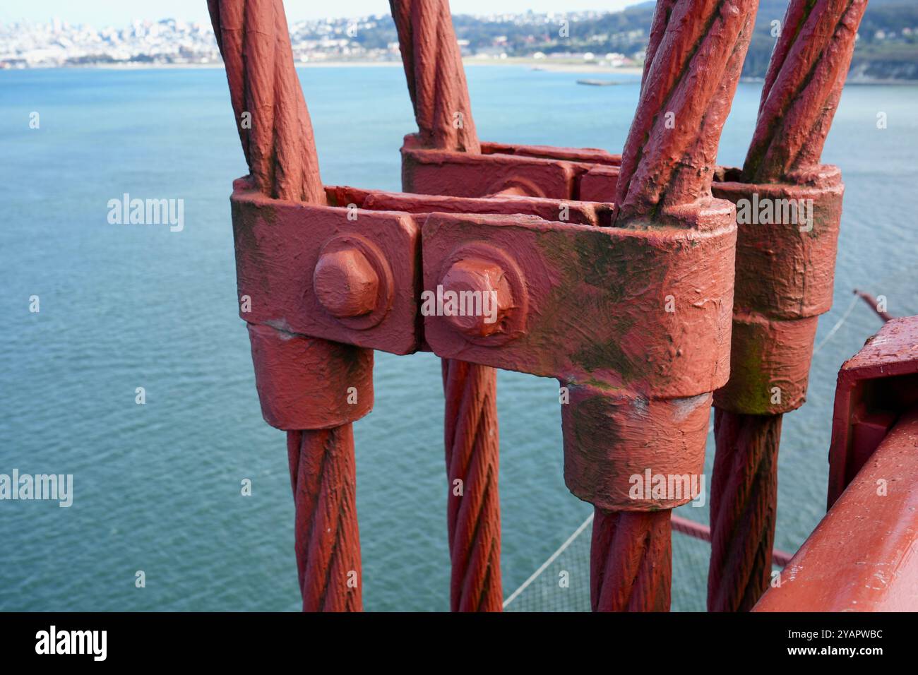 Detail of cable fastening from The Golden Gate Bridge with sea behind ...