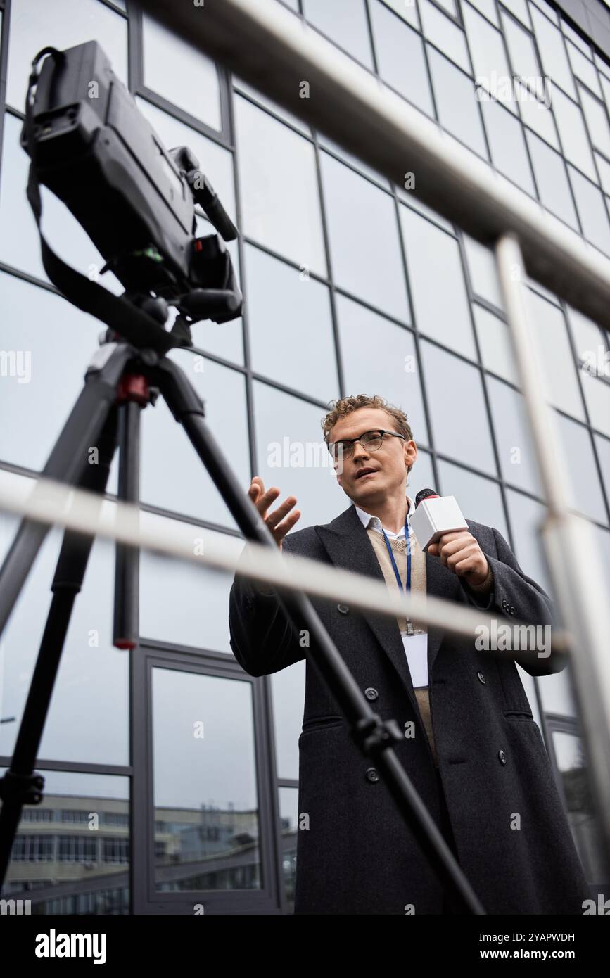 A professional journalist shares insights with a microphone at a ...