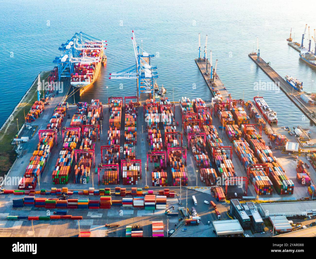 A large container ship is docked at a port Stock Photo - Alamy