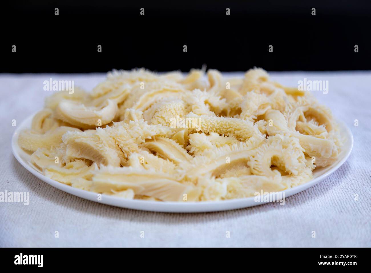 Beef tripe (bucho), beef stomach, tripe on a white plate. Dobradinha ...
