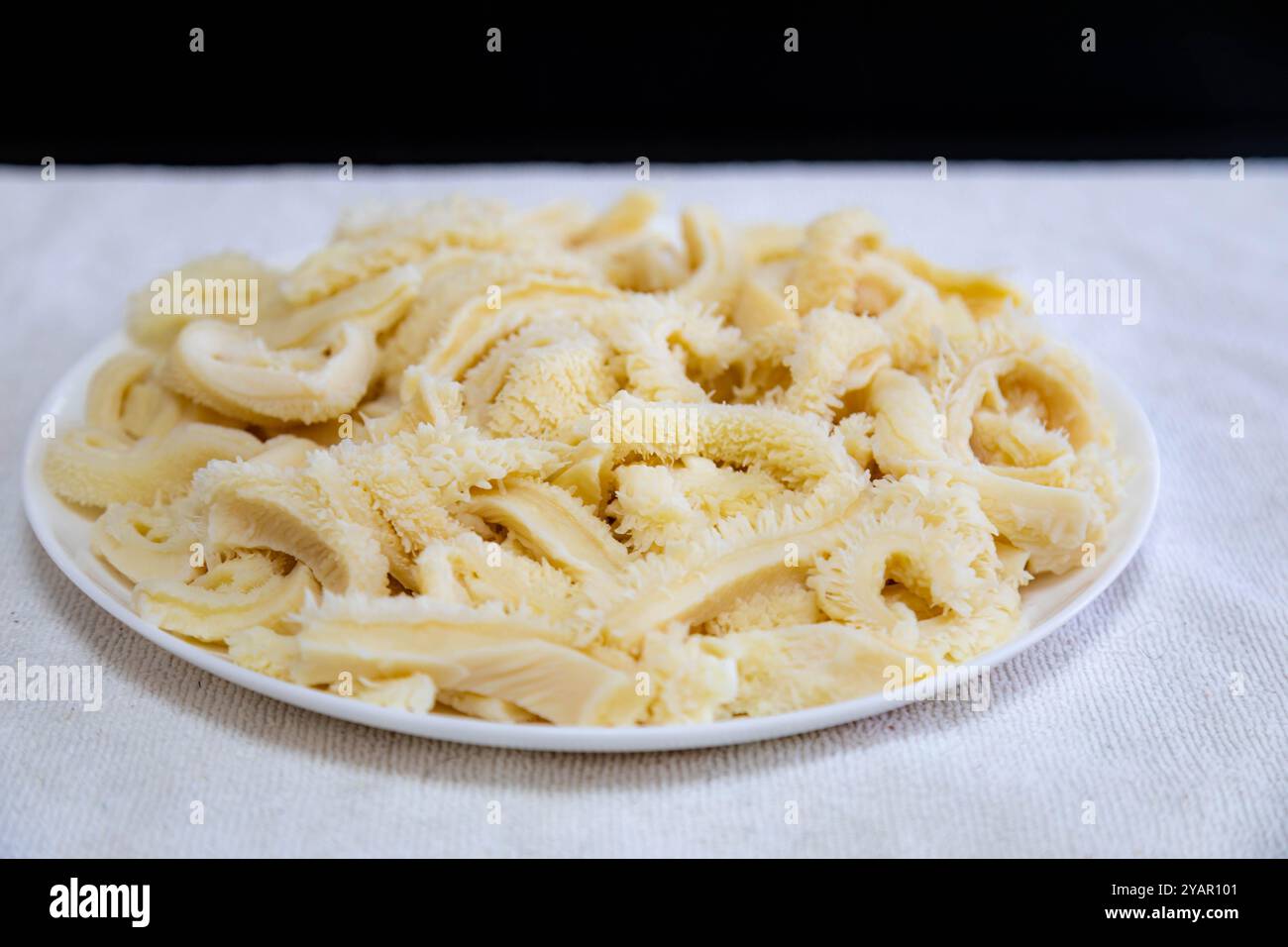 Beef tripe (bucho), beef stomach, tripe on a white plate. Dobradinha ...