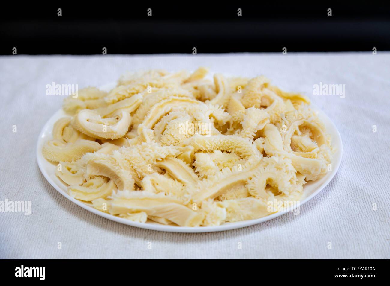 Beef tripe (bucho), beef stomach, tripe on a white plate. Dobradinha ...