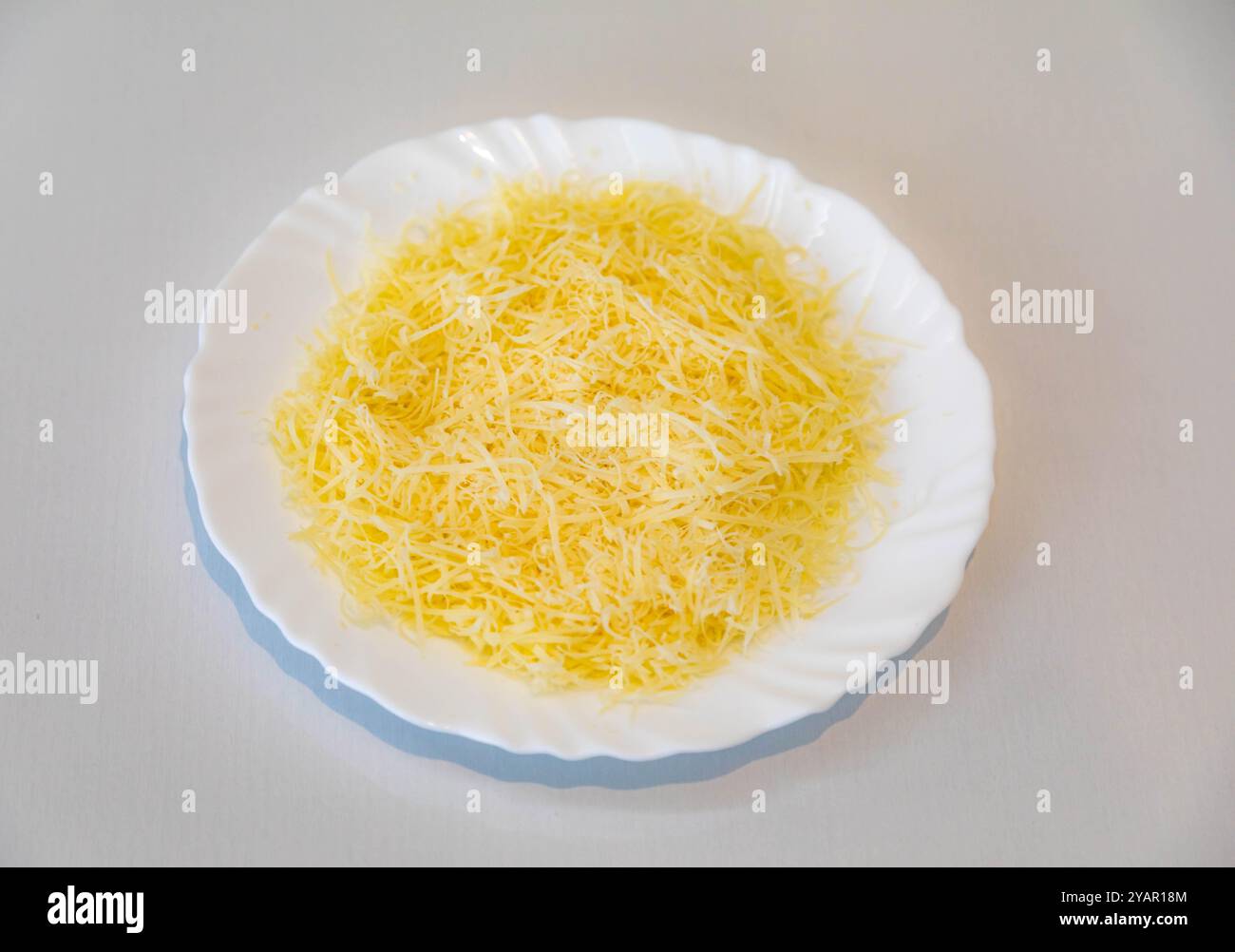 Grated parmesan cheese on a white plate. Pecorino Romano cheese Stock ...