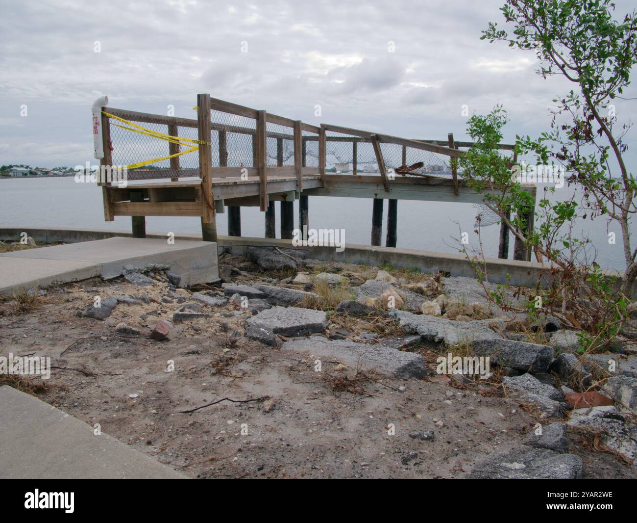 Side view damaged Wooden Beach Access Bridge late afternoon. Gulfport ...