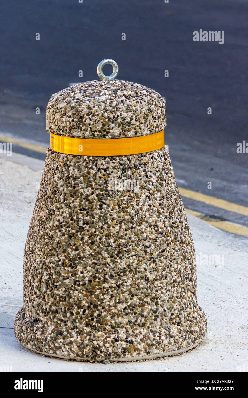 a stone bollard in the street to block the entrance Stock Photo - Alamy