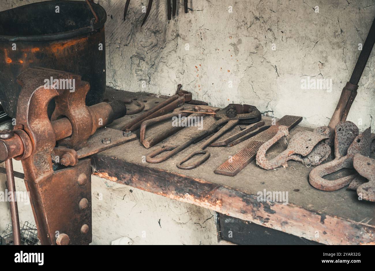 Old rusty tools on an old workbench in a museum Stock Photo - Alamy