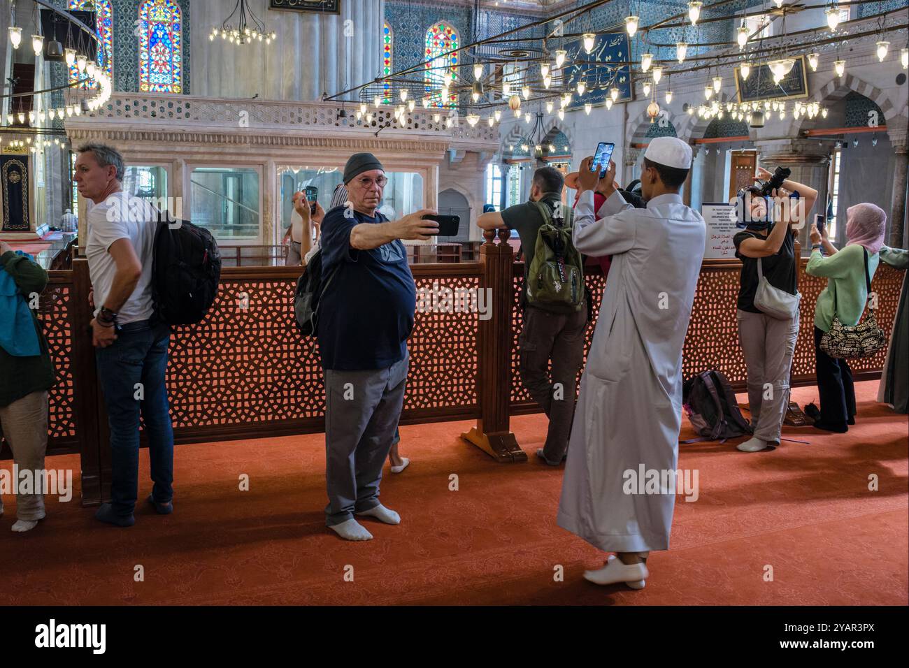 Tourists taking photographs in the Blue Mosque, Istanbul, Turkey Stock ...