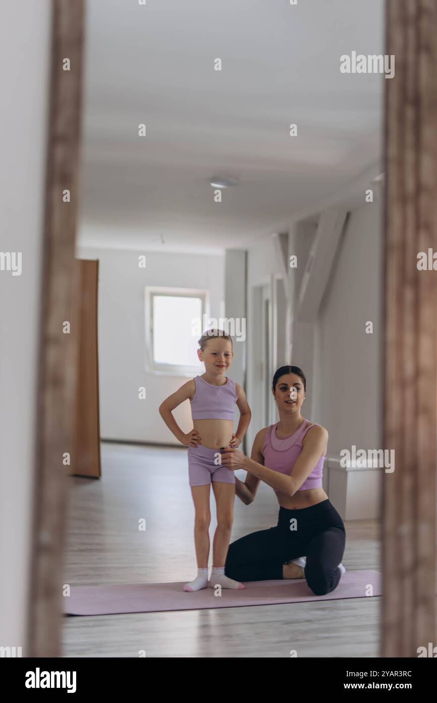 Baby ballet studio. Little ballerina with a coach in dance class ...