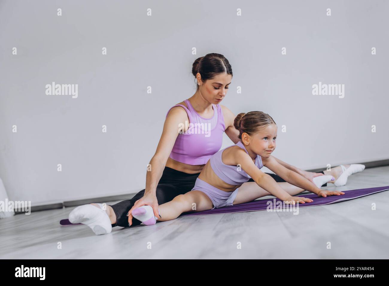 children's gymnastics and muscle stretching exercises. High quality ...