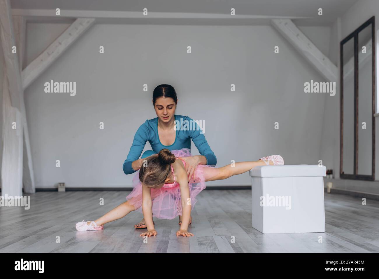 Baby ballet studio. Little ballerina with a coach in dance class ...