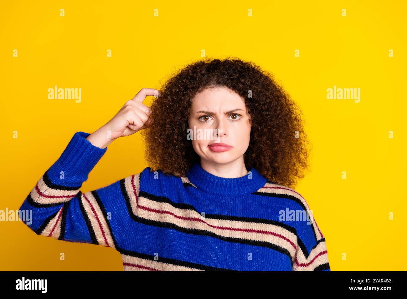 Photo of confused clueless woman with perming coiffure dressed striped ...