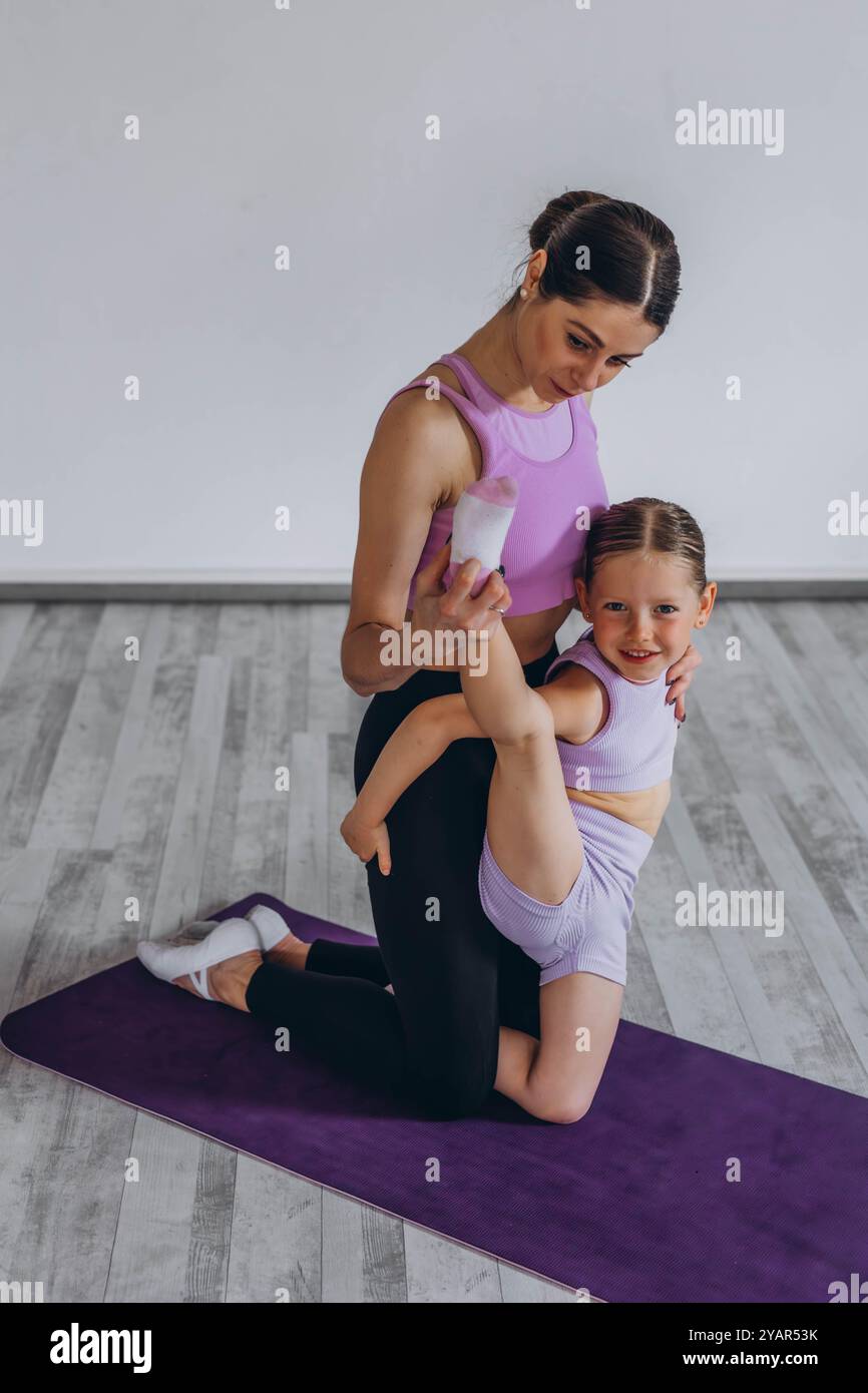 children's gymnastics and muscle stretching exercises. High quality ...