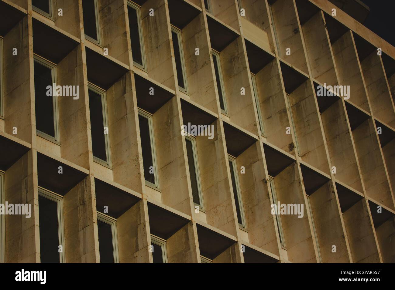 Business building concrete facade view in perspective with many windows ...