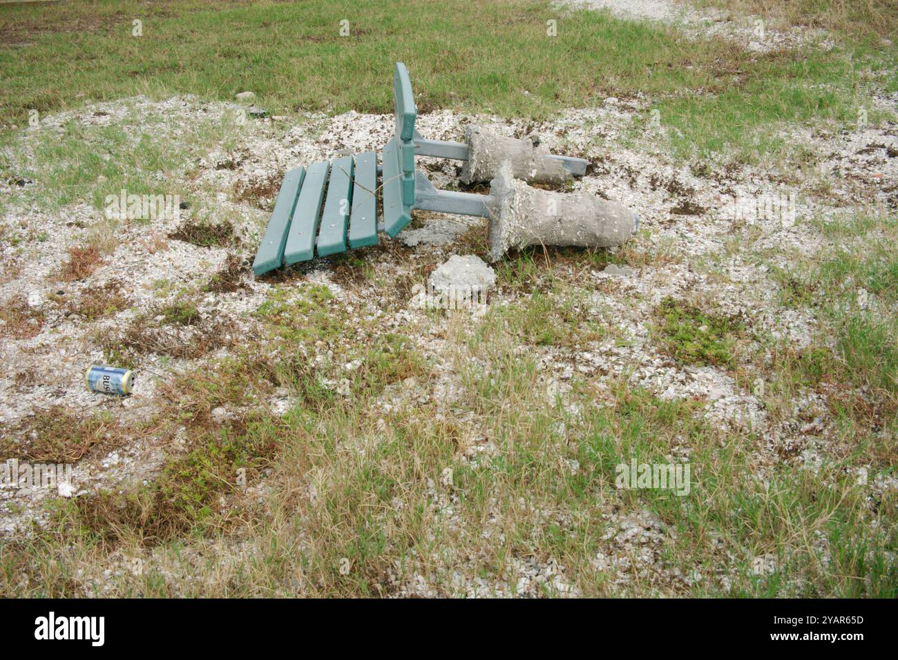Green park bench and concrete footers pulled out of the ground after ...