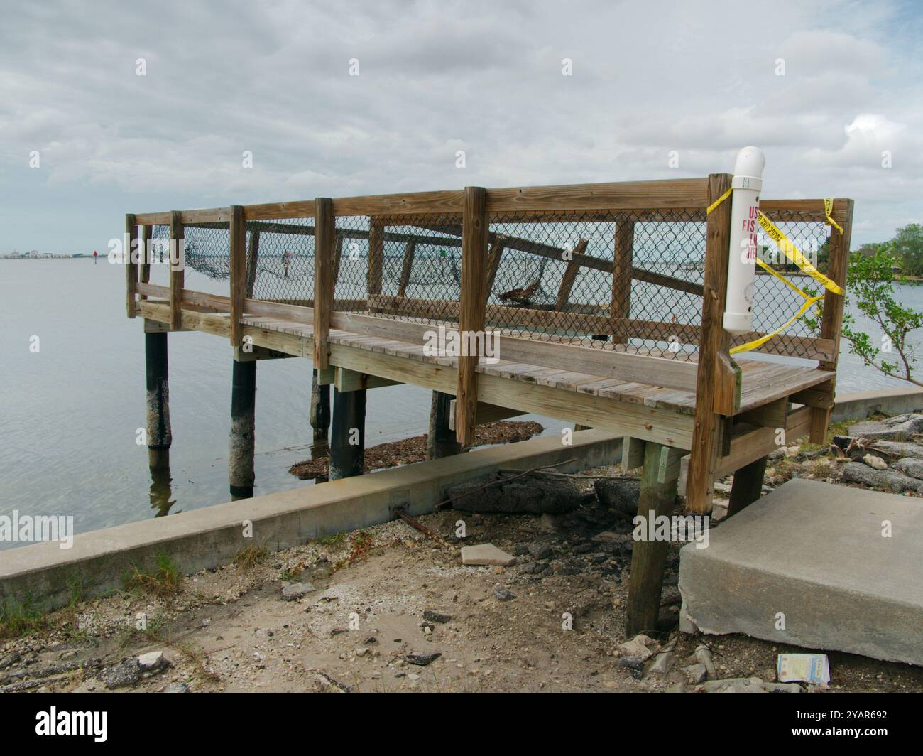Side view damaged Wooden Beach Access Bridge late afternoon. Gulfport ...