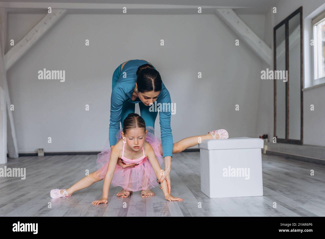 Baby ballet studio. Little ballerina with a coach in dance class ...
