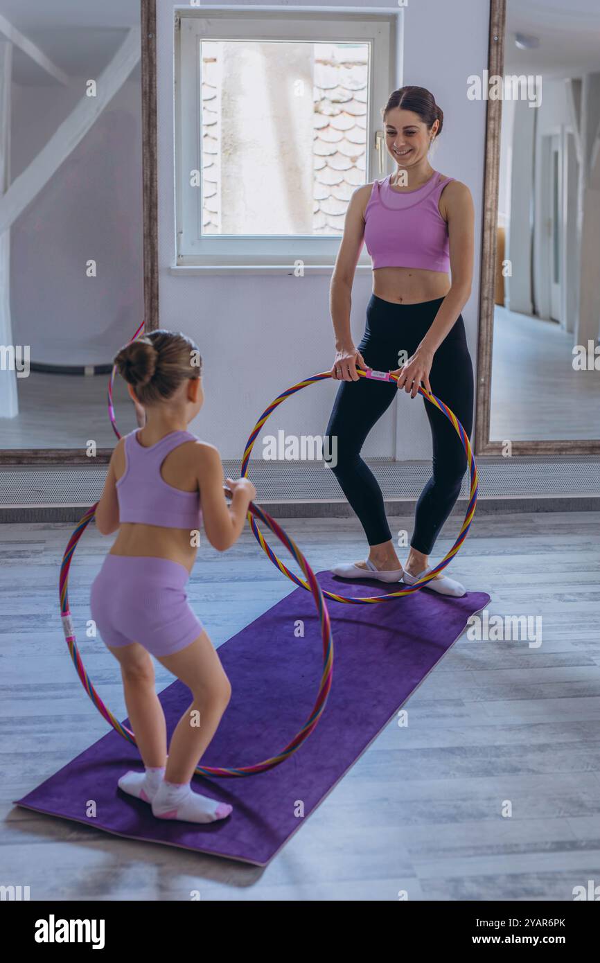 GymnasGymnast child performs an exercise with hoop.Children's ...