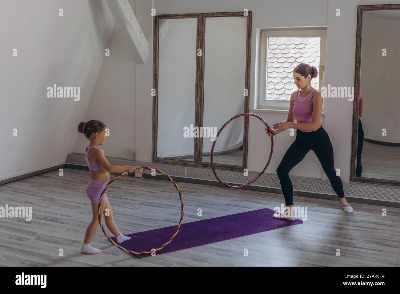 GymnasGymnast child performs an exercise with hoop.Children's ...