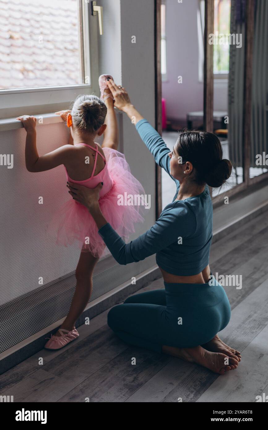 Baby ballet studio. Little ballerina with a coach in dance class ...