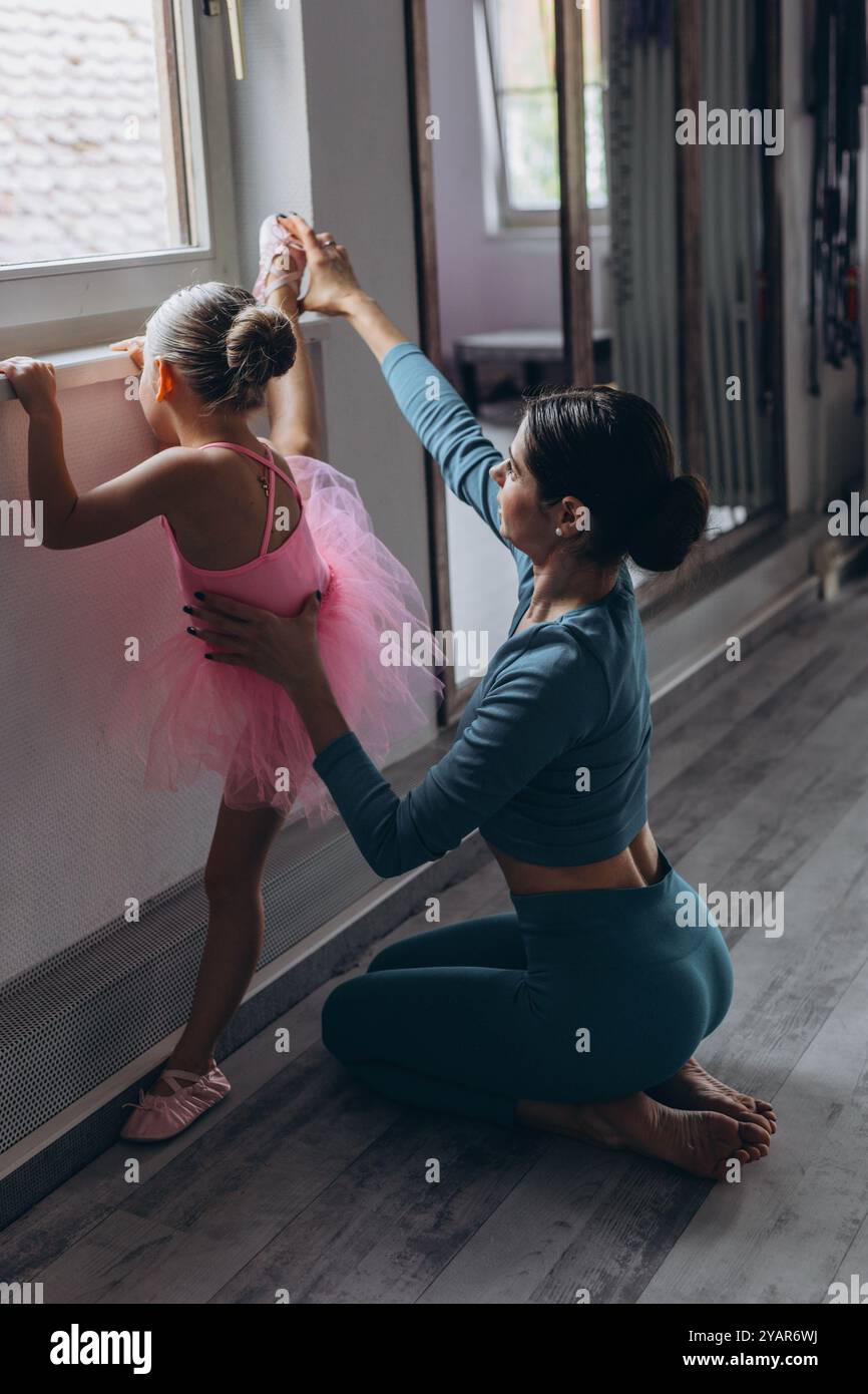 Baby ballet studio. Little ballerina with a coach in dance class ...