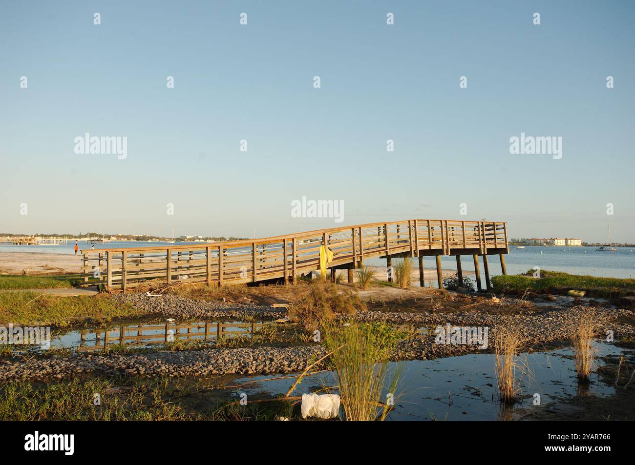 Side view damaged Wooden Beach Access Bridge late afternoon. Gulfport ...