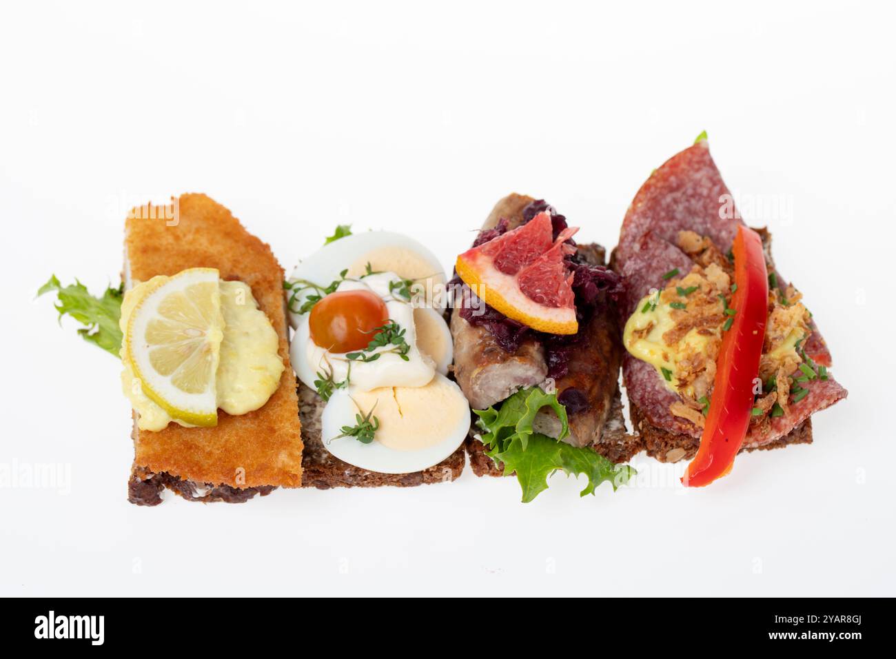 selection of open-faced Danish sandwiches (Smørrebrød) on dark rye ...
