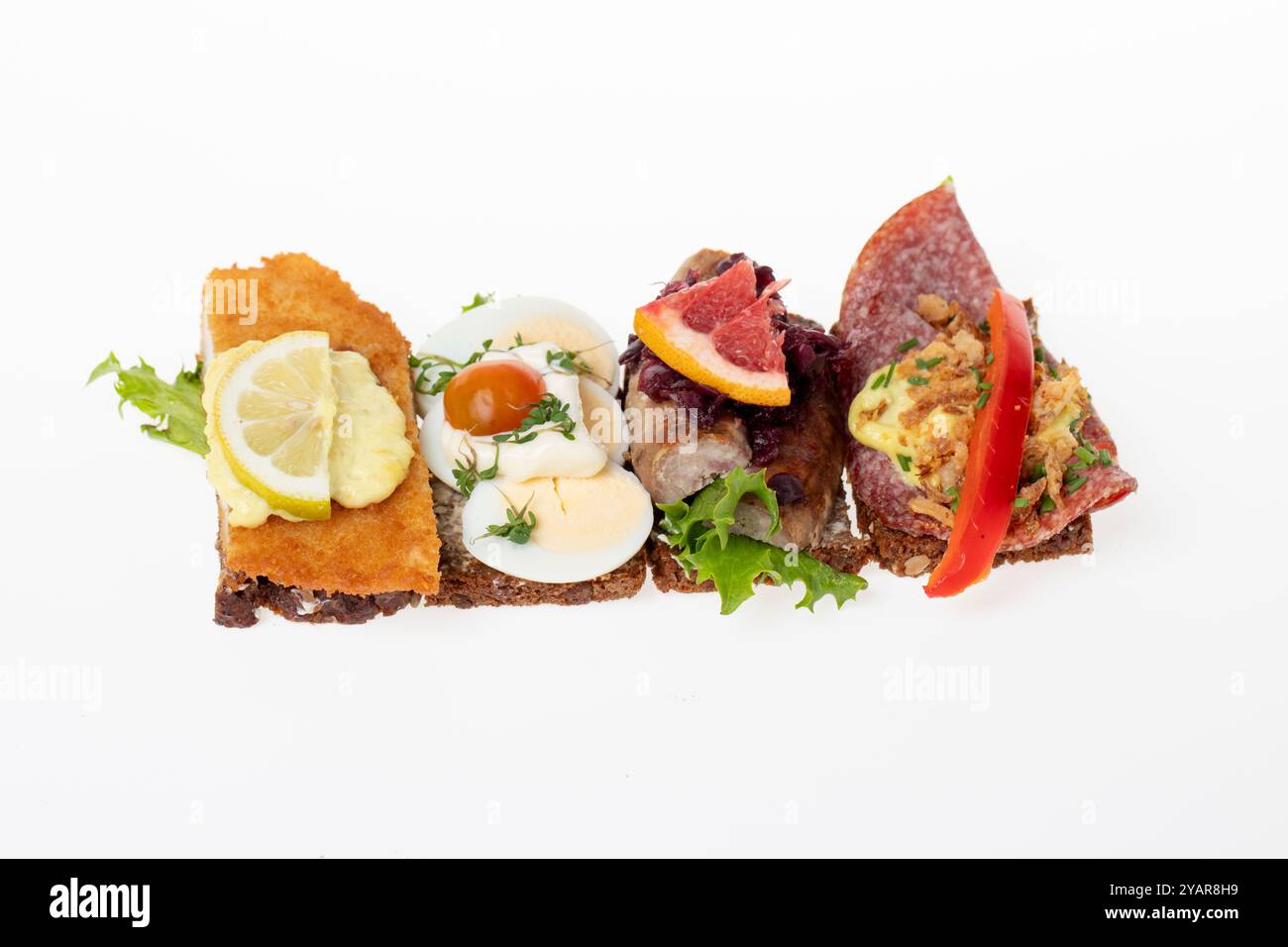 selection of open-faced Danish sandwiches (Smørrebrød) on dark rye ...
