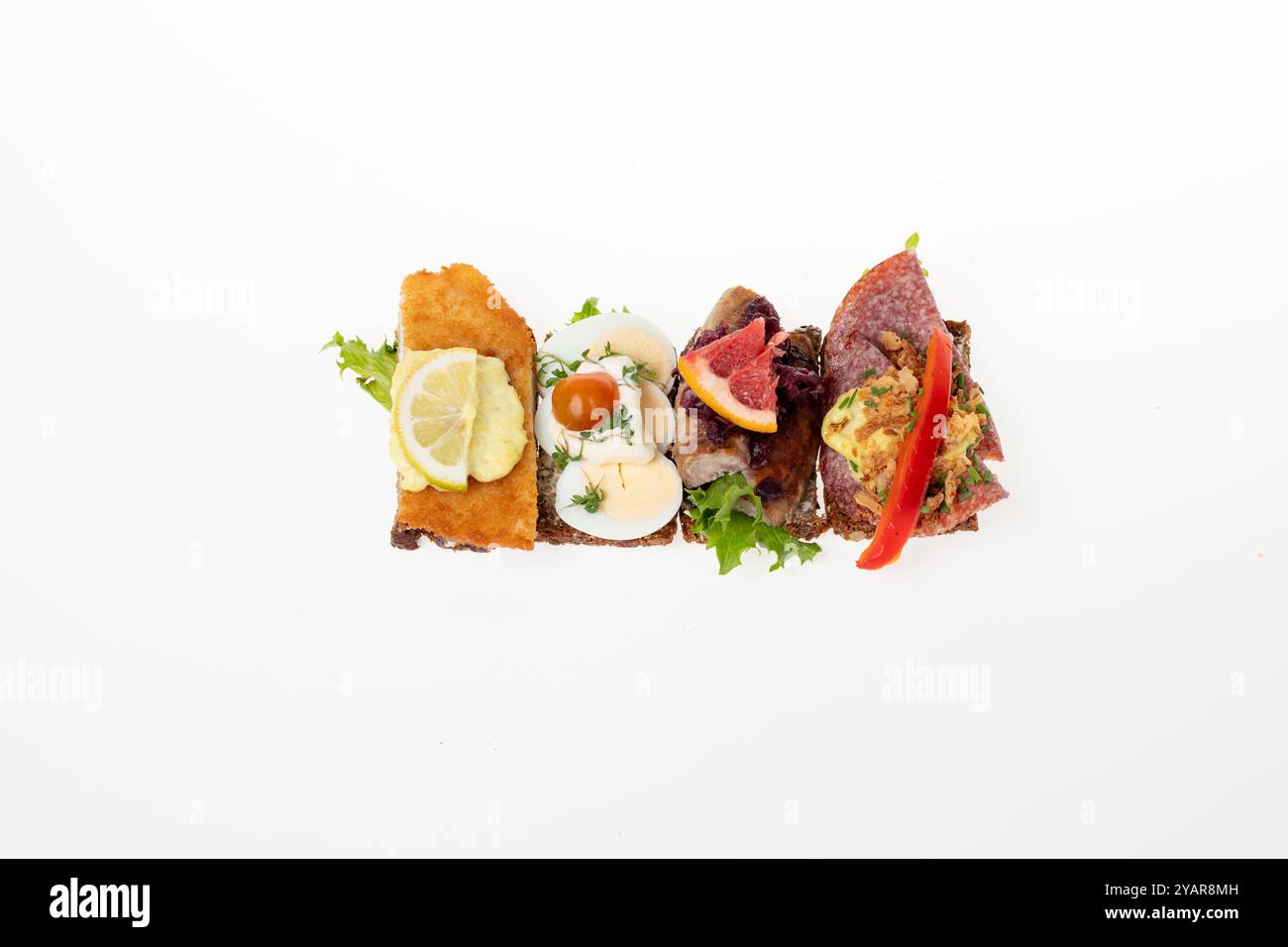 selection of open-faced Danish sandwiches (Smørrebrød) on dark rye ...