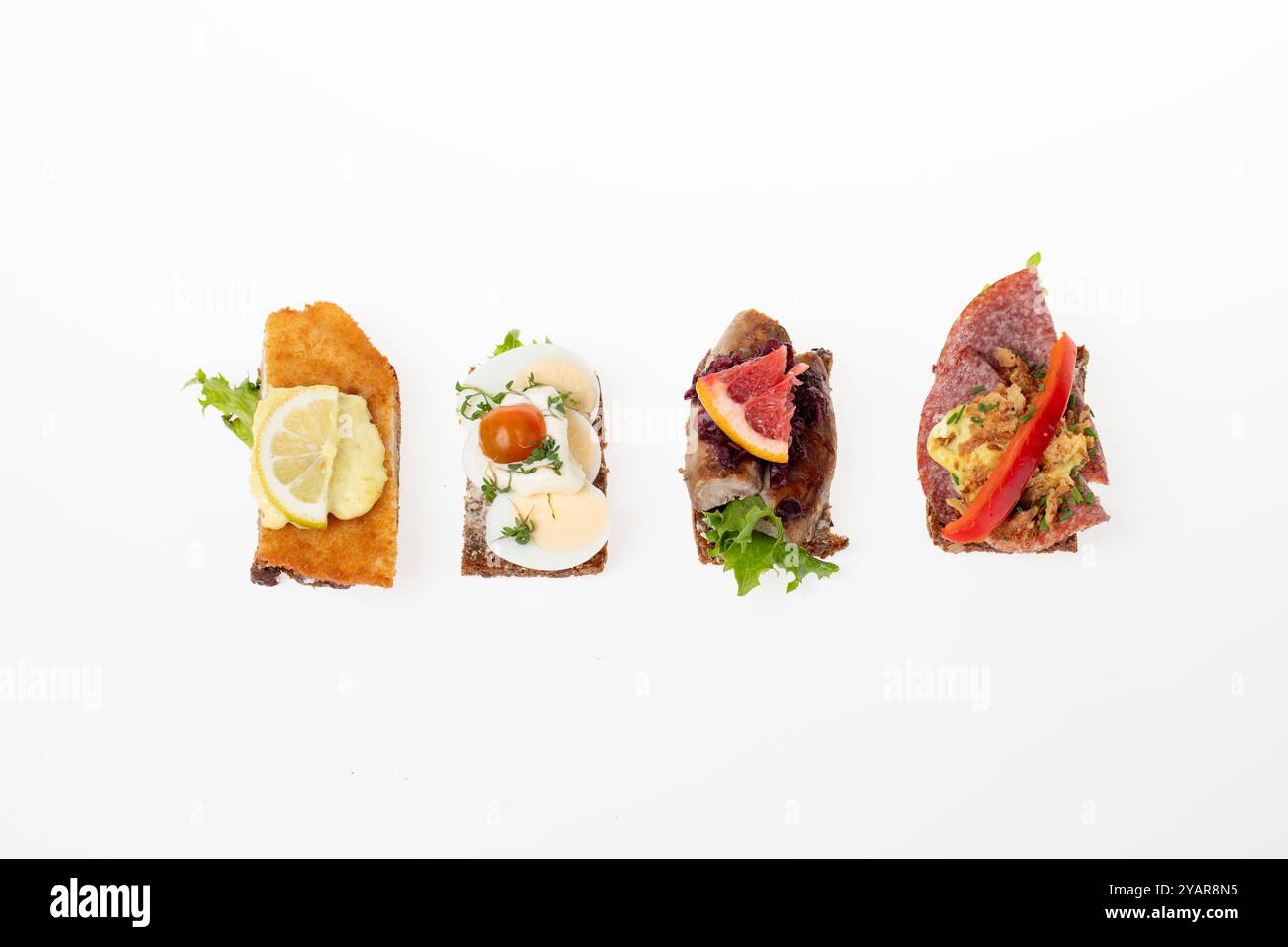 selection of open-faced Danish sandwiches (Smørrebrød) on dark rye ...