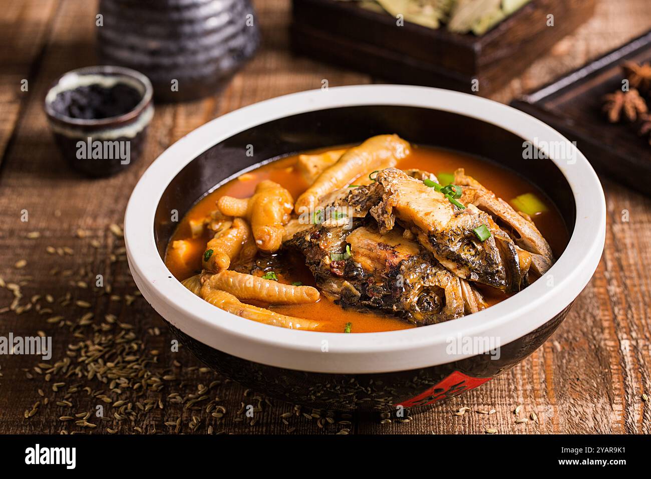 Braised fish and chicken feet Stock Photo - Alamy