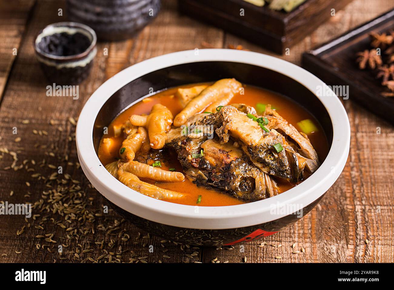 Braised fish and chicken feet Stock Photo - Alamy