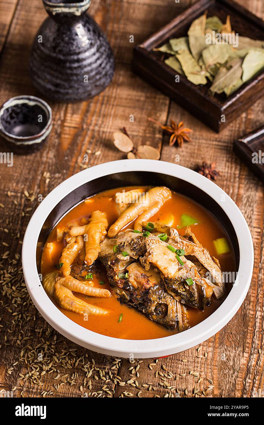Braised fish and chicken feet Stock Photo - Alamy