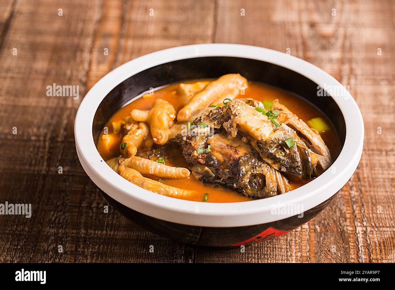 Braised fish and chicken feet Stock Photo - Alamy