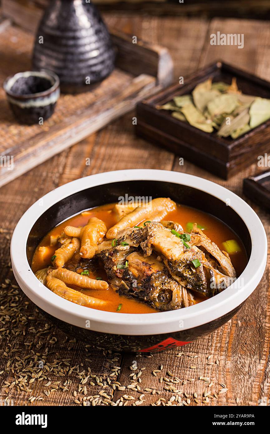 Braised fish and chicken feet Stock Photo - Alamy