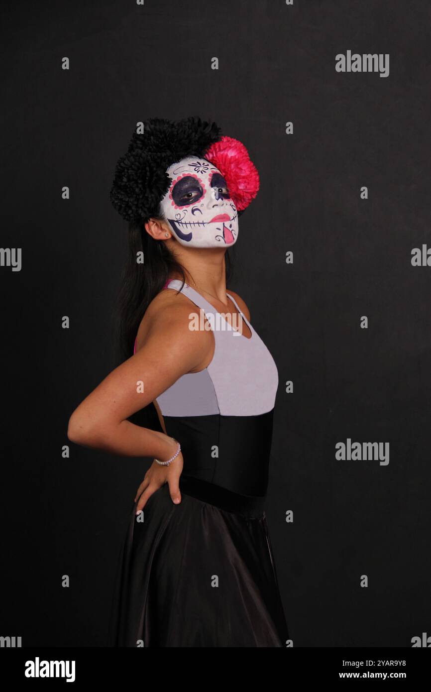 Mexican teenage woman with skull or catrina makeup and flower crown ...