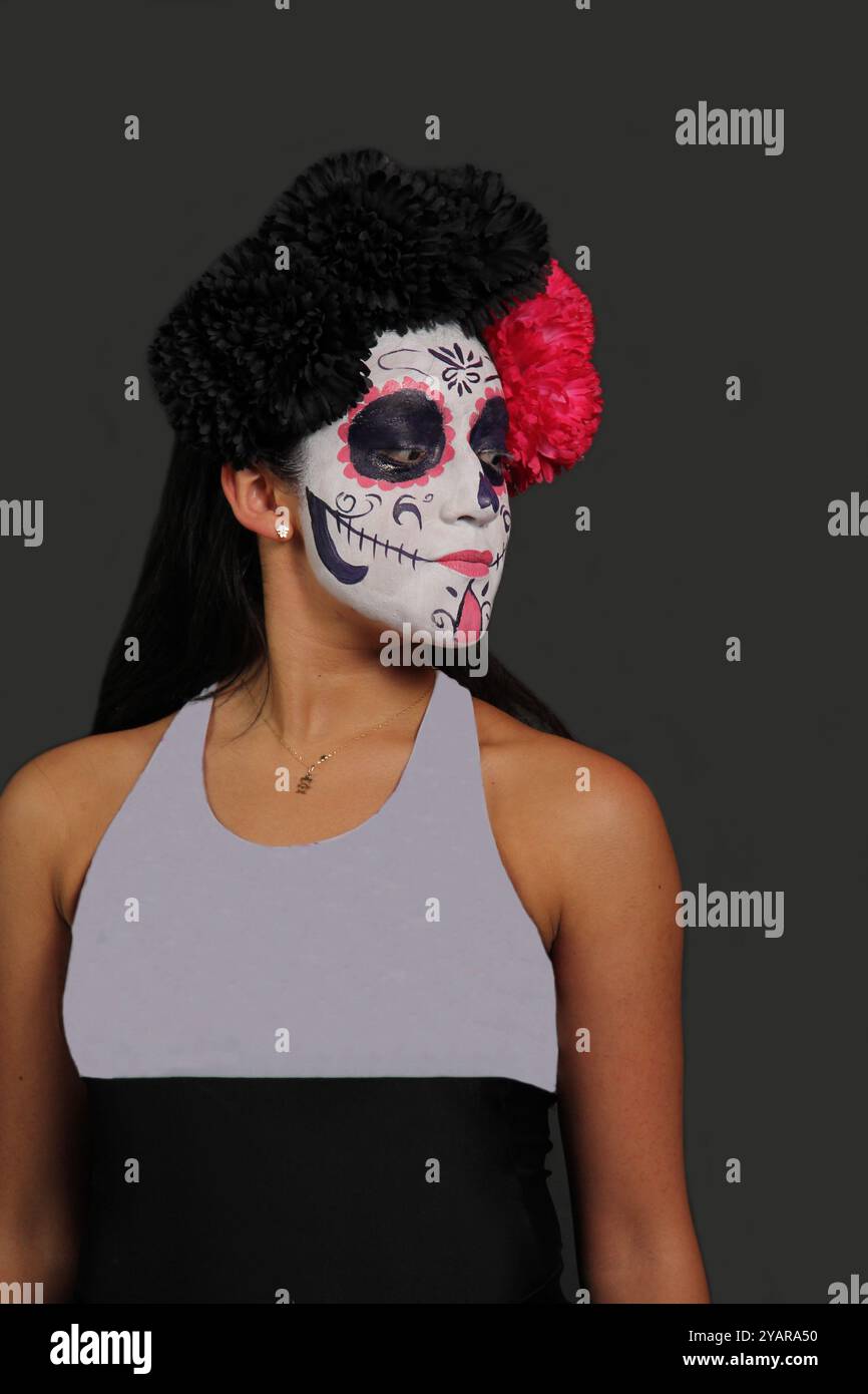 Mexican teenage woman with skull or catrina makeup and flower crown ...