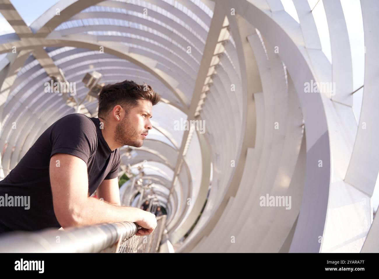 Male athlete leaning on railing hi-res stock photography and images - Alamy