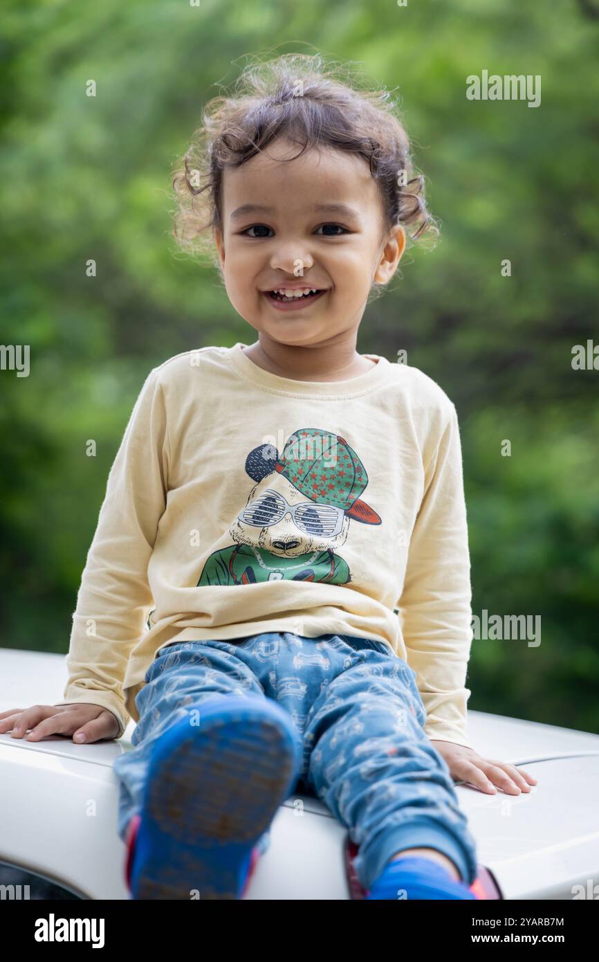 cute indian kid smiling face with blurred background at day Stock Photo ...
