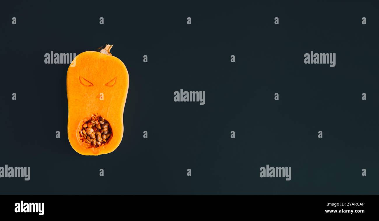 Butternut squash carved with spooky face, showcasing creative Halloween ...