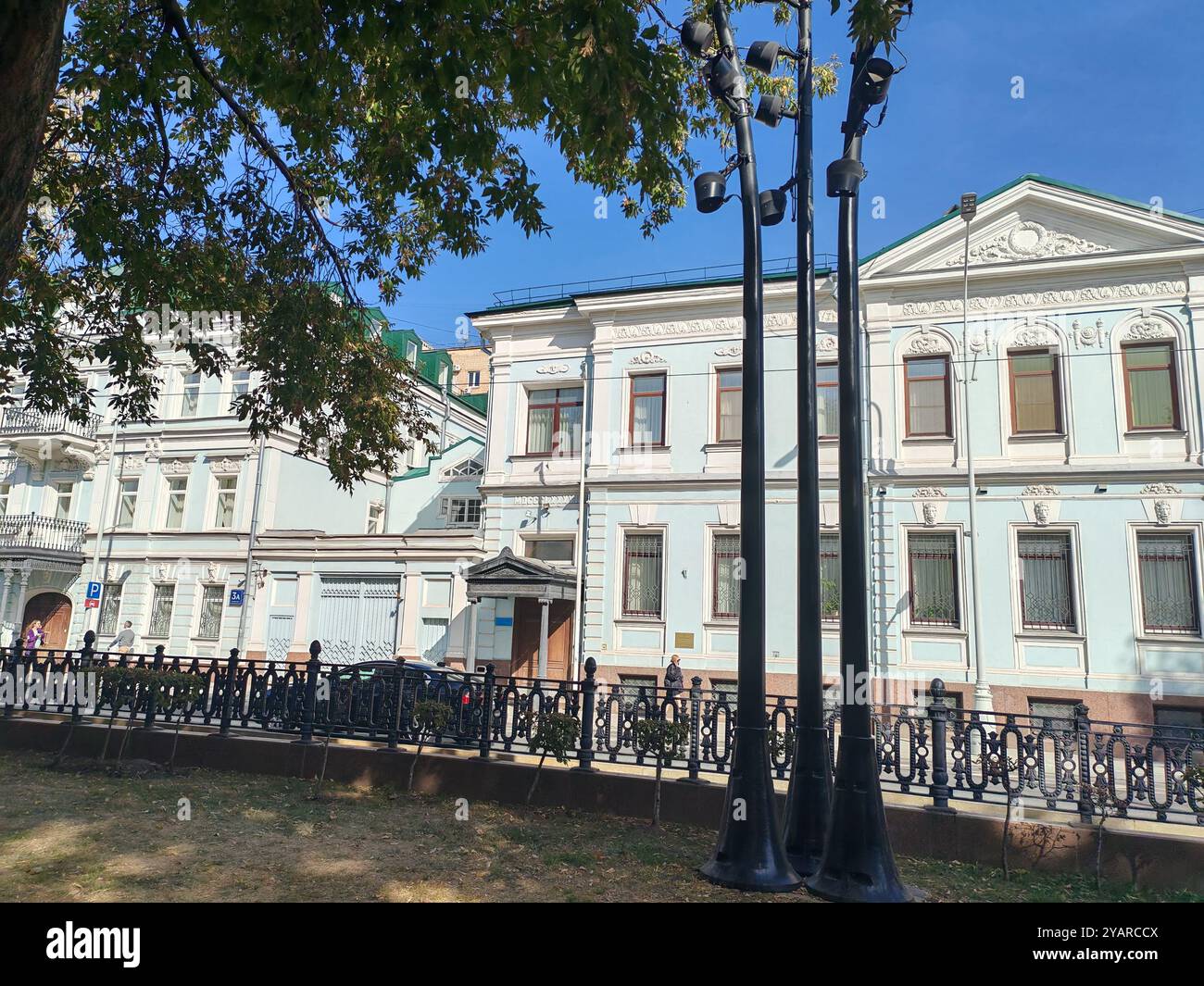 large two-story classical building with ornate detailing, large windows ...