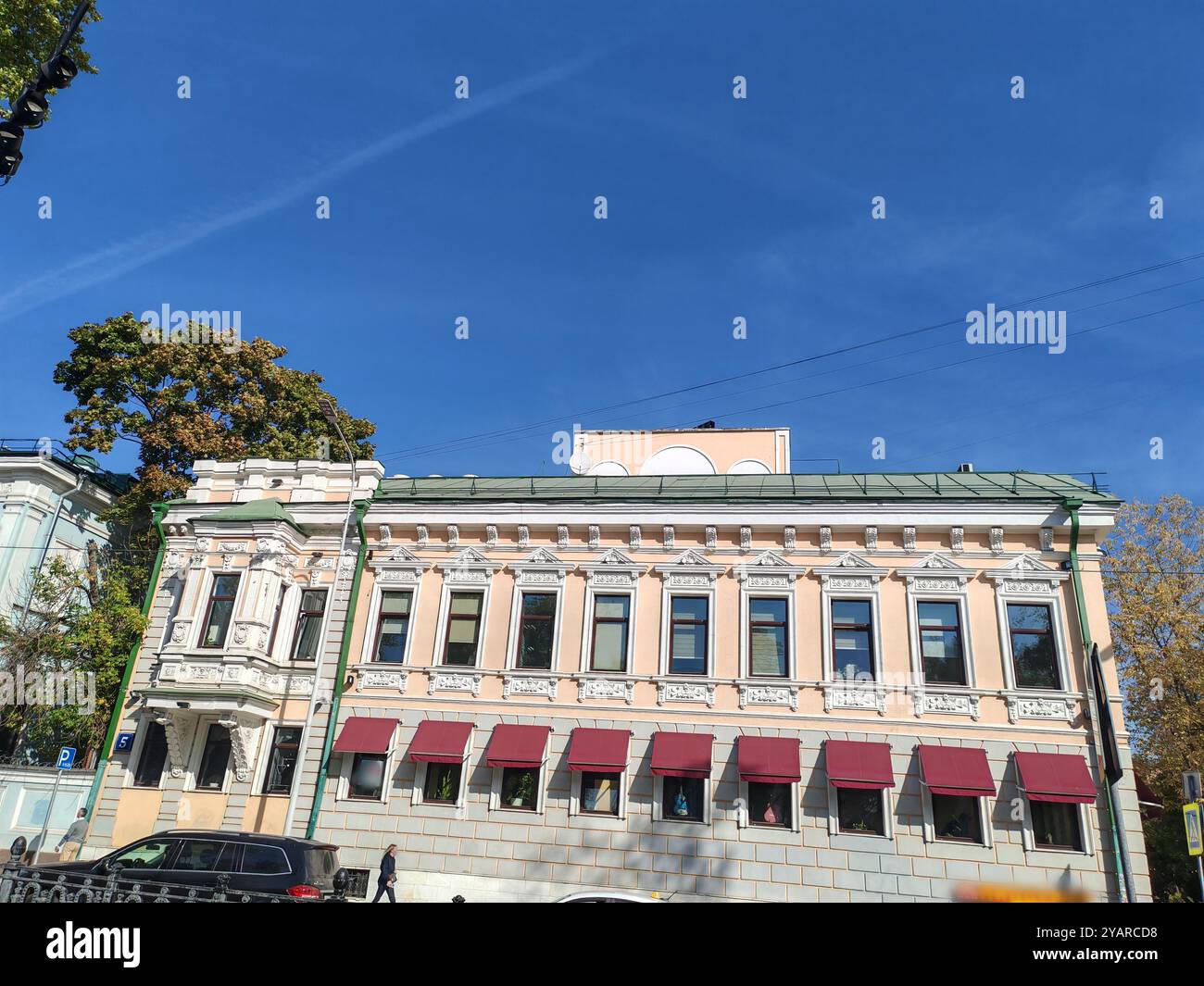large two-story classical building with ornate detailing, large windows ...