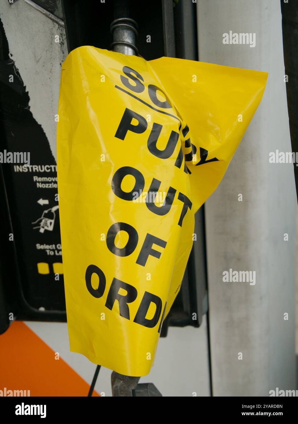 Yellow Sorry pumps out of order bag wrap over pump handle at a gas ...