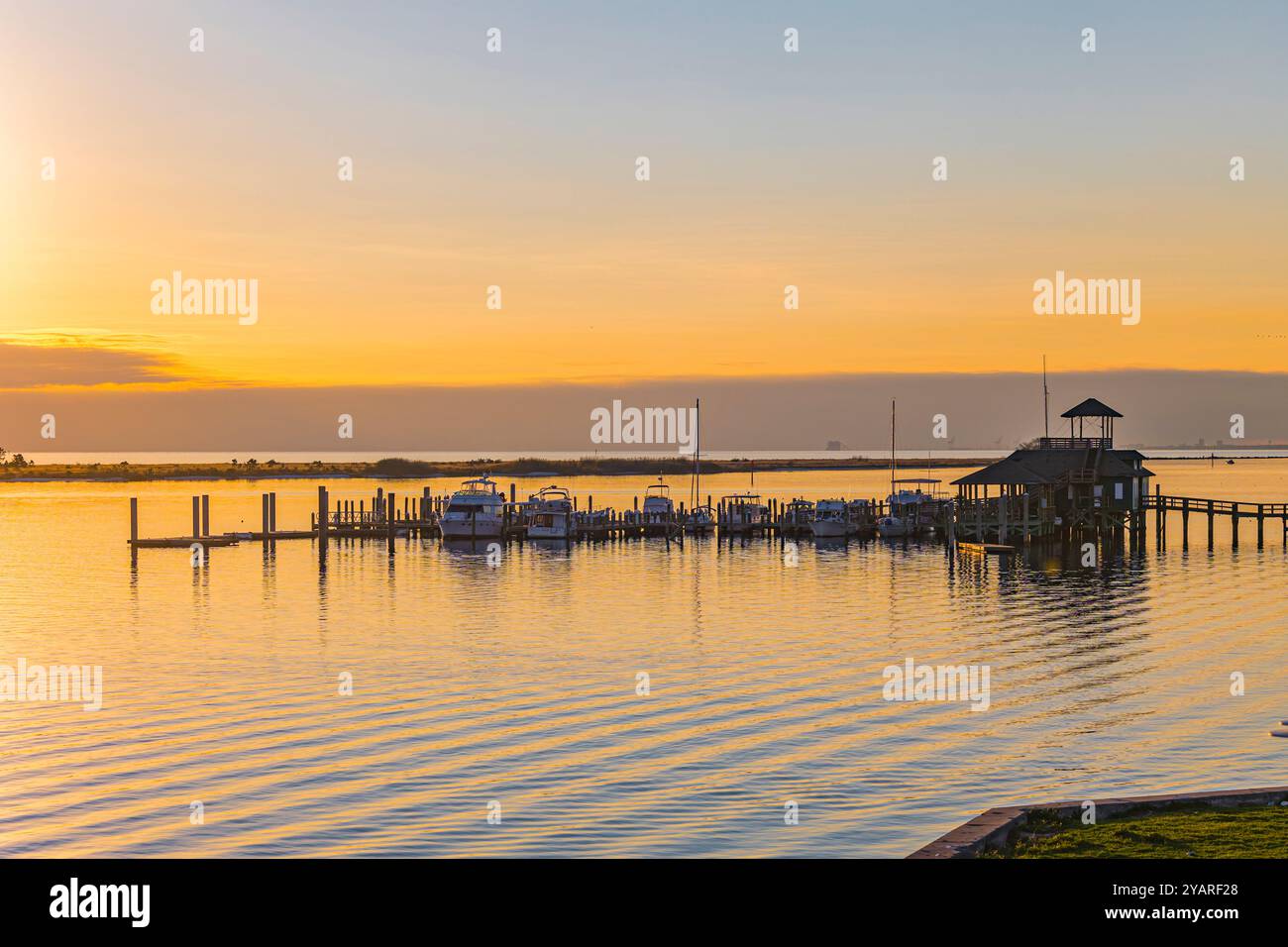Biloxi Schooner Pier Complex at sunset on the Gulf of Mexico at Biloxi ...