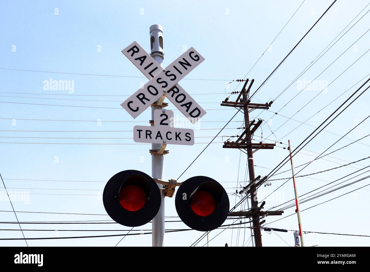Railroad Crossing 2 Tracks sign Stock Photo - Alamy